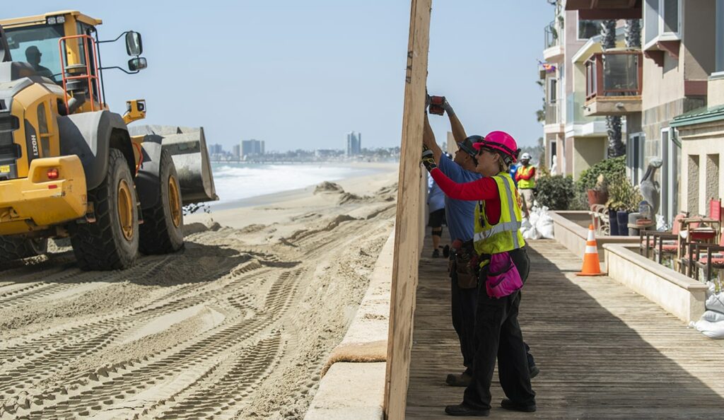 UPDATE: High surf pounds through Peninsula sand berm, threatening ...