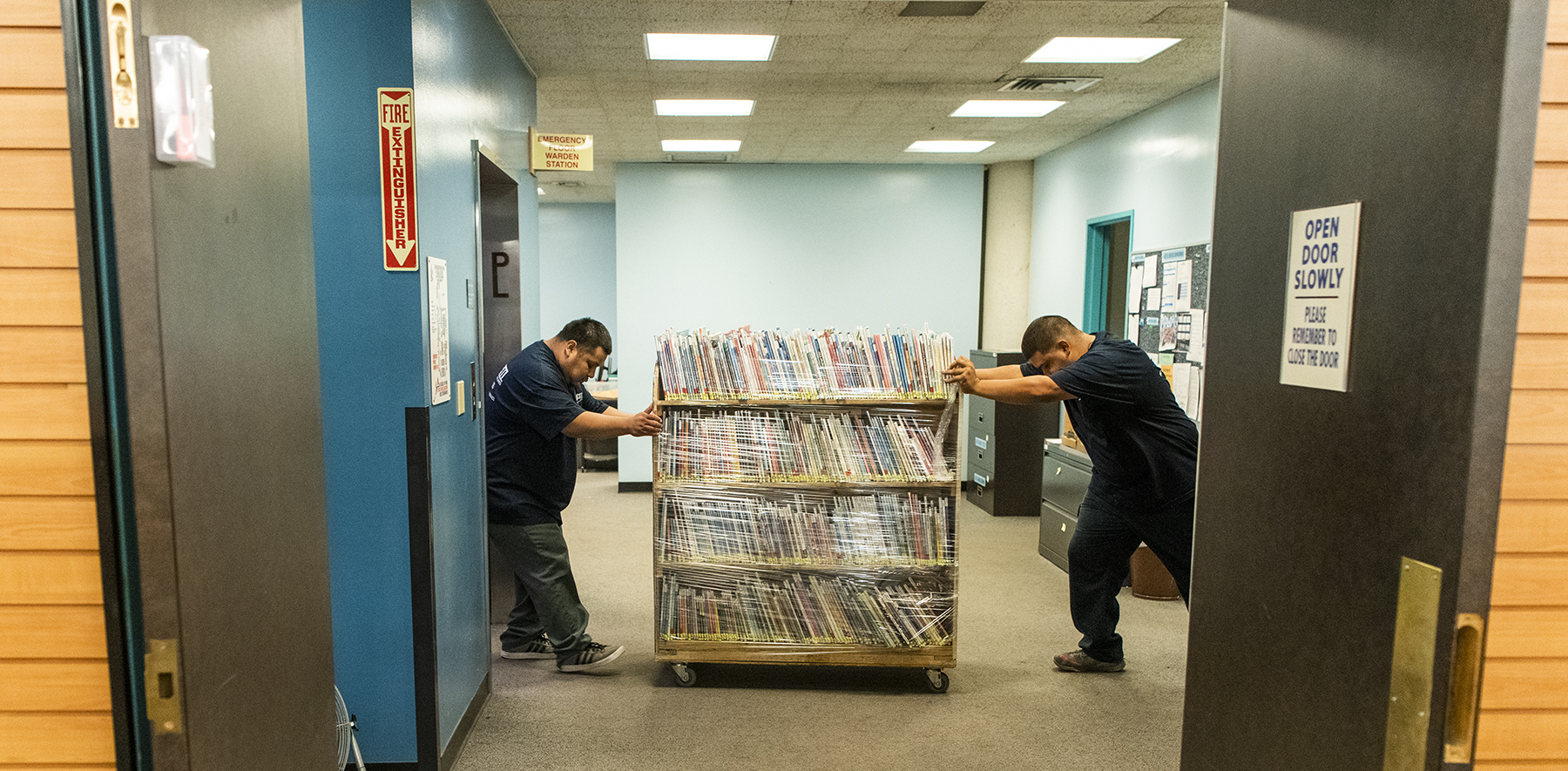 IN PICTURES: You hate moving books? Try moving a whole library • Long ...