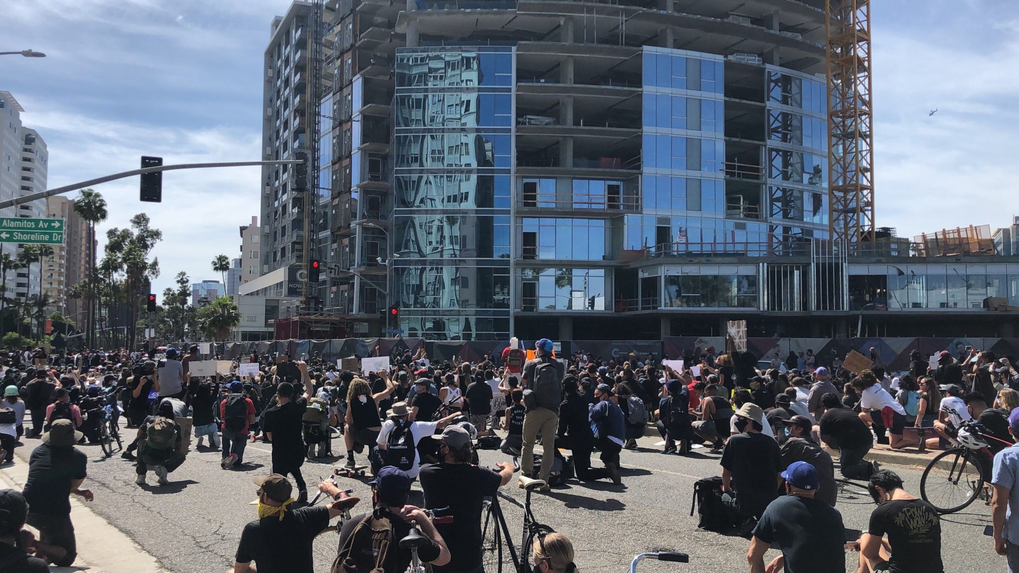 Angry over police killings, masses march through Long Beach; city ...