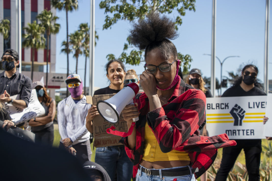 A week on, scores of protesters still gathering in Long Beach against ...
