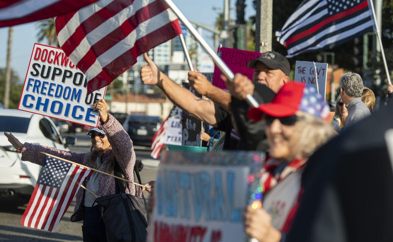 Vaccine mandate protests arrive in Long Beach as nearly 150 gather at ...