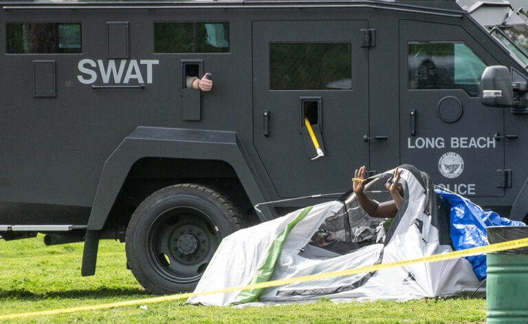 Man in tent surrenders after hours-long SWAT standoff at park ...