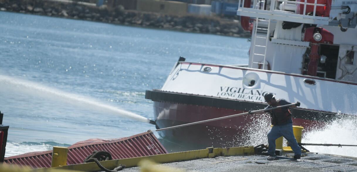 Dozens of shipping containers spill from docked vessel at Port of Long ...