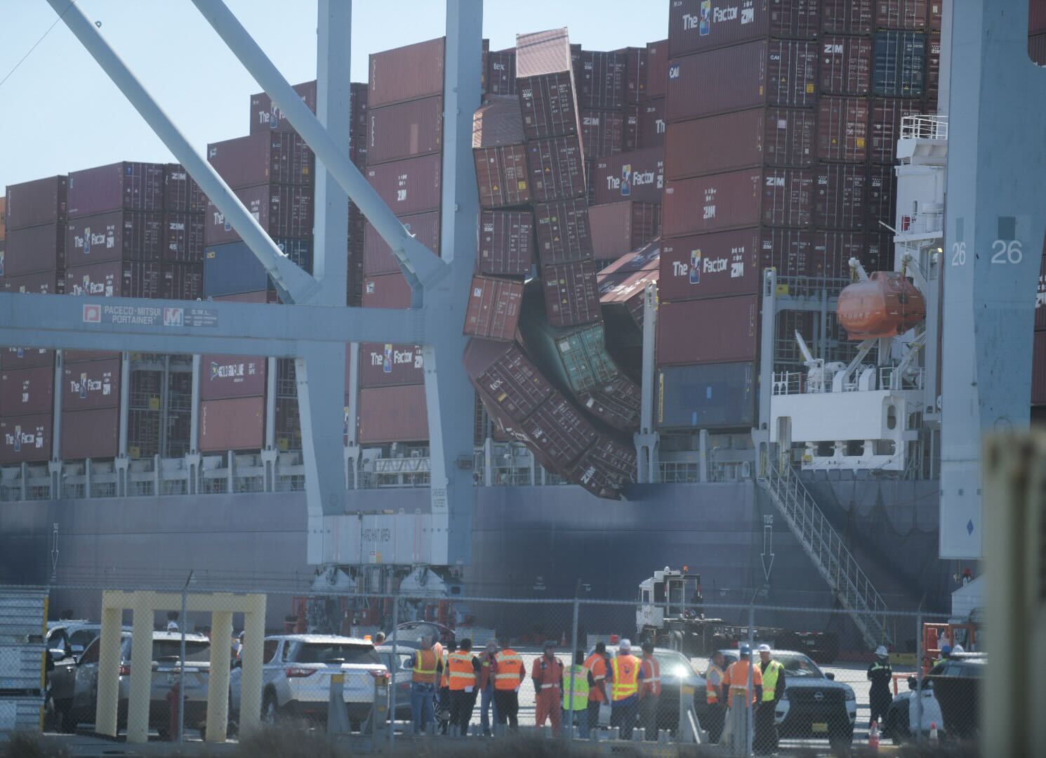 Dozens of shipping containers spill from docked vessel at Port of Long ...